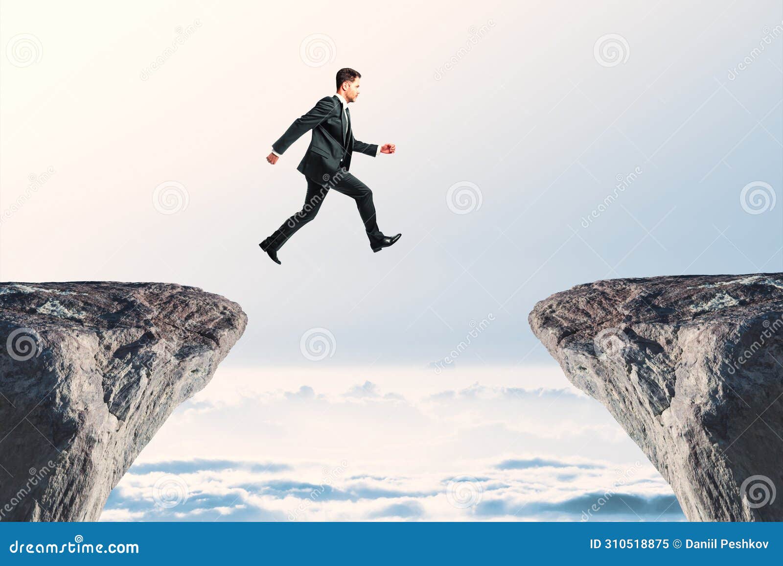 Side View of Man Jumping on Cliff Edge on Bright Blue Sky Background ...