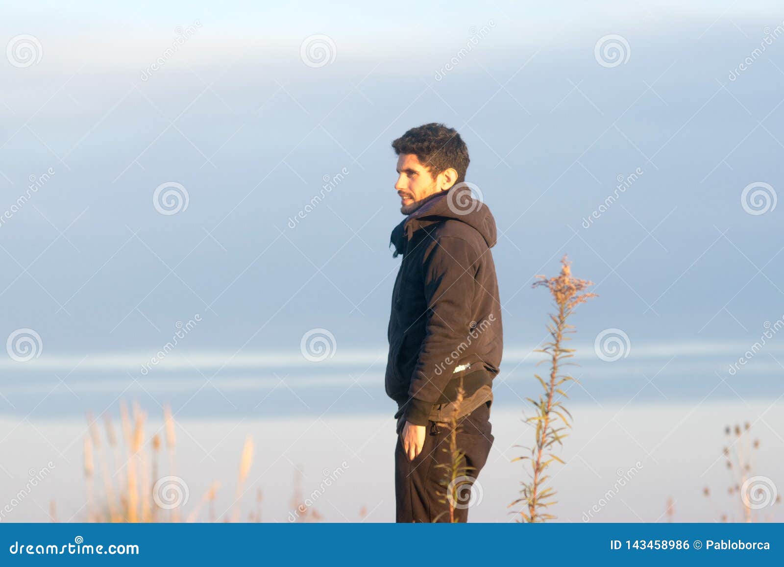Side View of a Man Looking the Horizon at Sunset Stock Photo - Image of ...