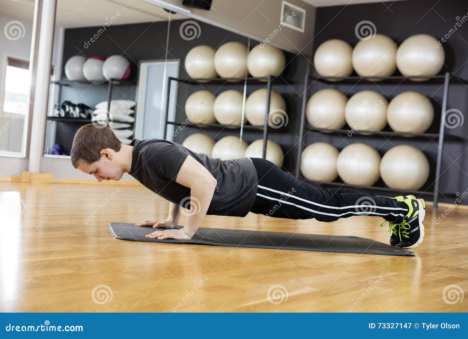 Side View of Man Performing Pushups in Gym Stock Image - Image of ...