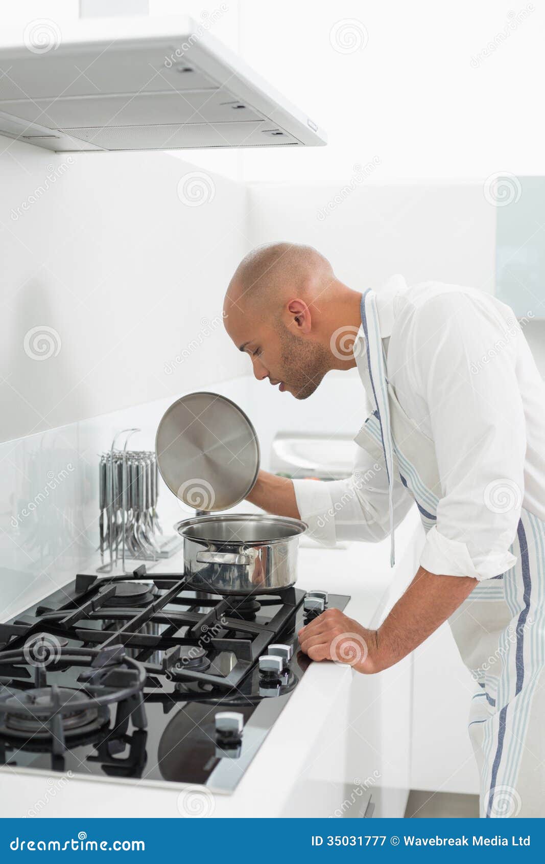 Side View of Man Preparing Food in Kitchen Stock Image - Image of ...
