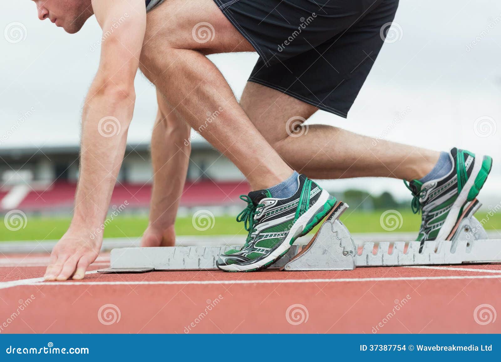 Side View of a Man Ready To Race on Running Trac Stock Photo - Image of ...