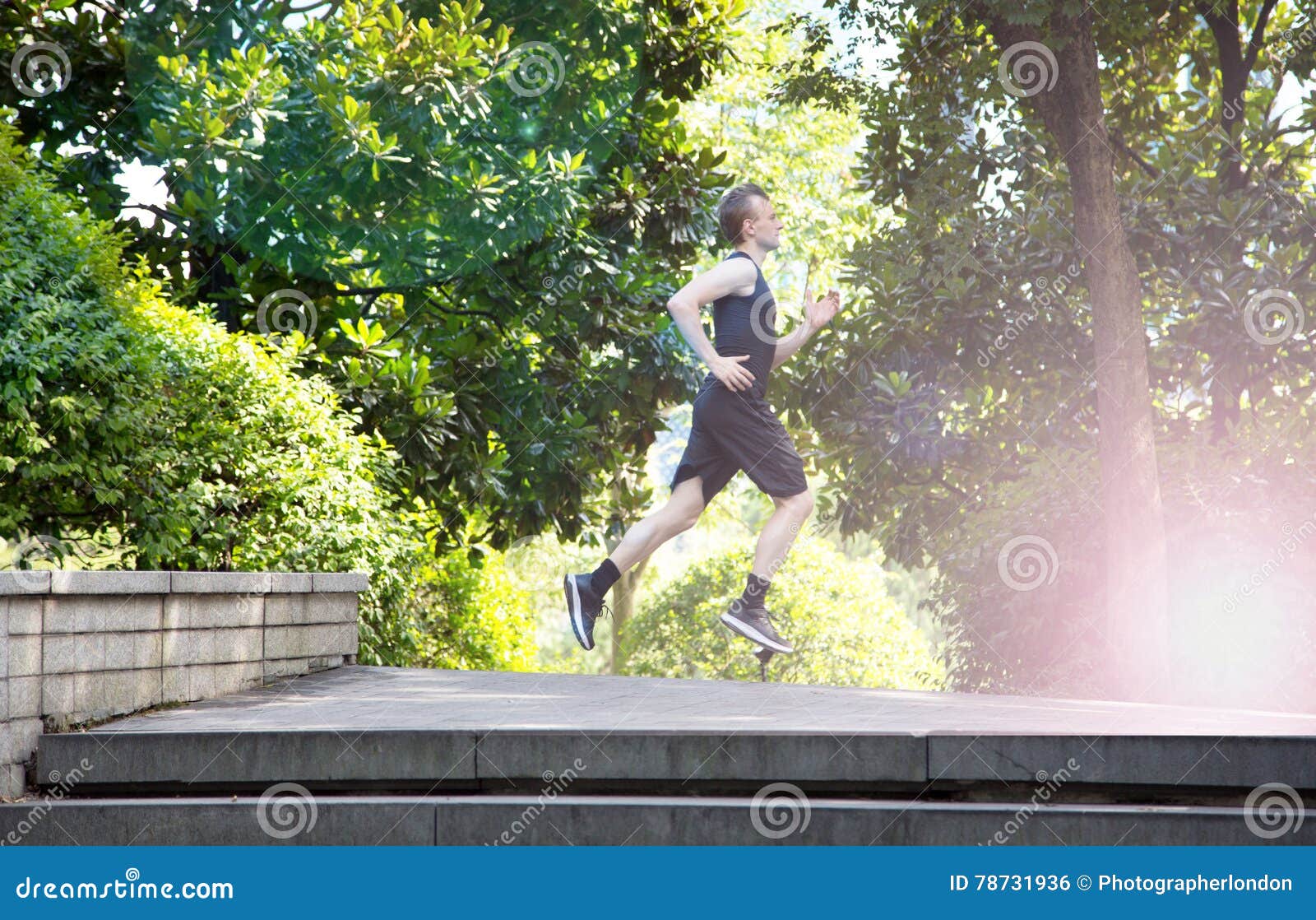 Side View of Man Running in Park Stock Photo - Image of energy ...