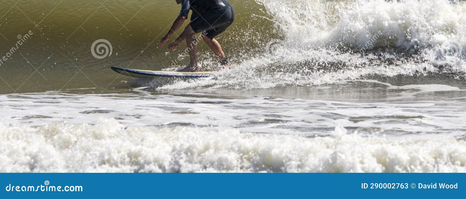 Side View of a Man Surfing Inside the Curl of a Wave Close Up Stock ...