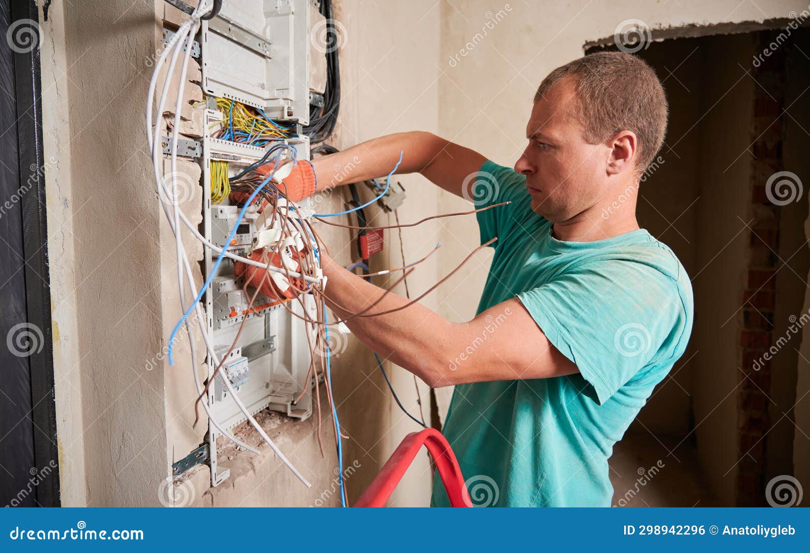 Male Electrician Repairing Electrical Control Panel at Home. Stock ...