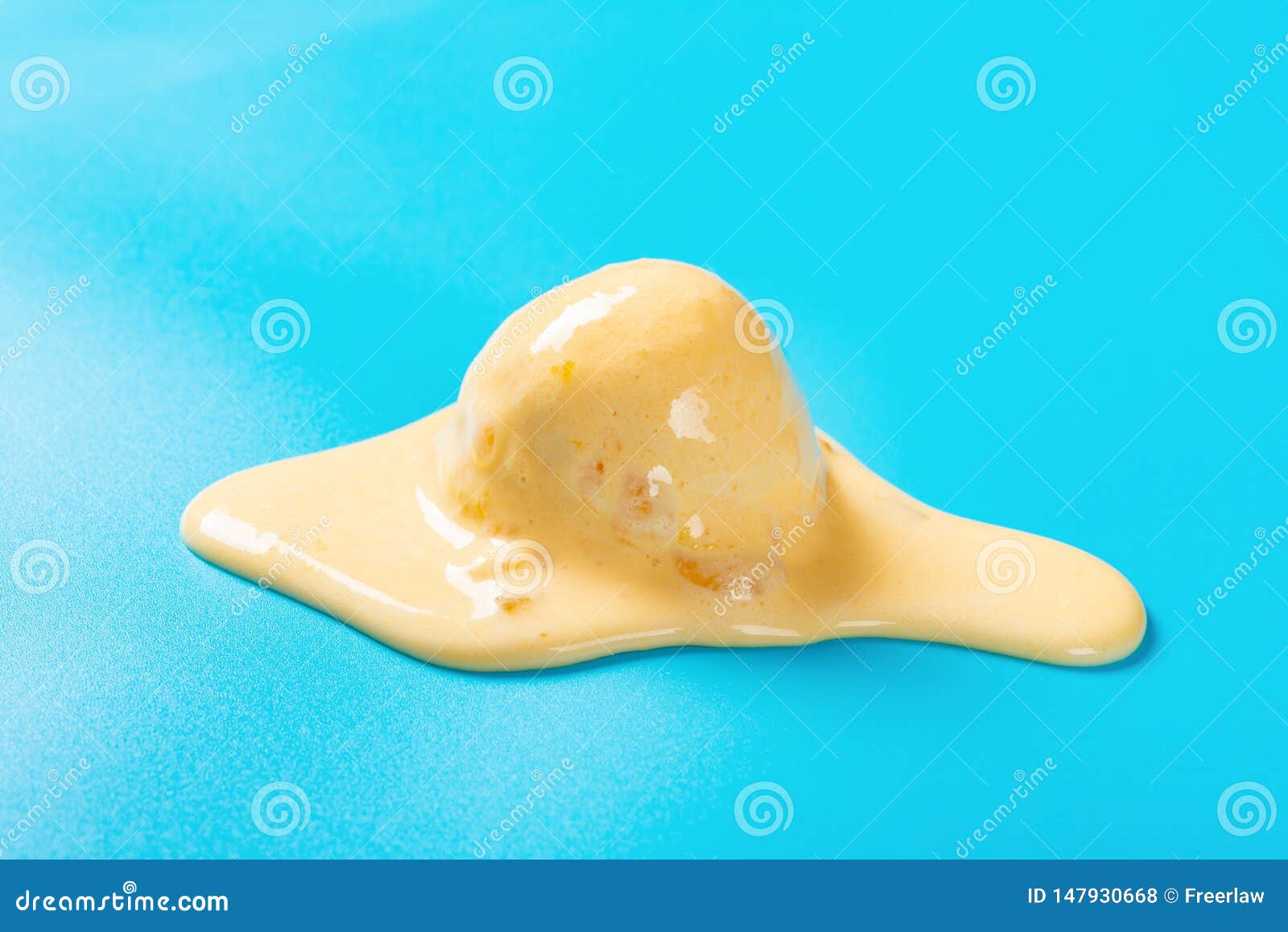 Mango Flavor Ice Cream Ball in a Melting Process on Blue Background ...