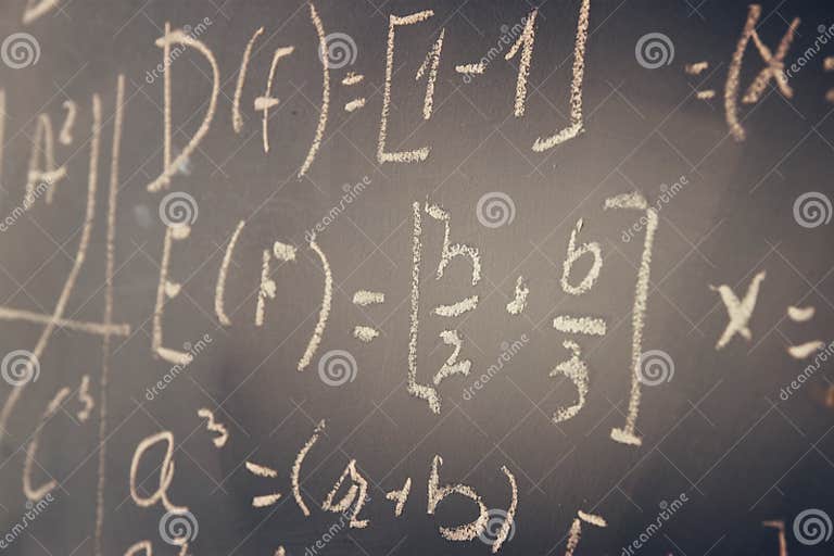 Side View of Math Formulas and Calculation Written Over Chalkboard ...