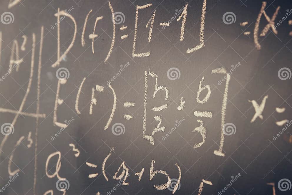 Side View of Math Formulas and Calculation Written Over Chalkboard ...