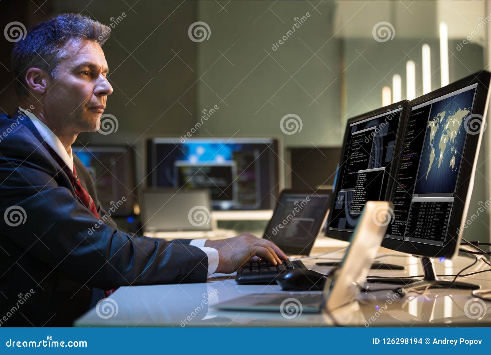 Businessman Working on Multiple Computers Stock Photo - Image of ...
