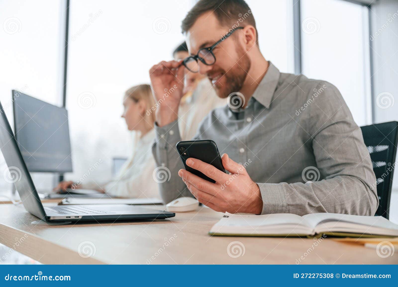 Side View of Man that is Sitting. Successful Team are Working Together ...