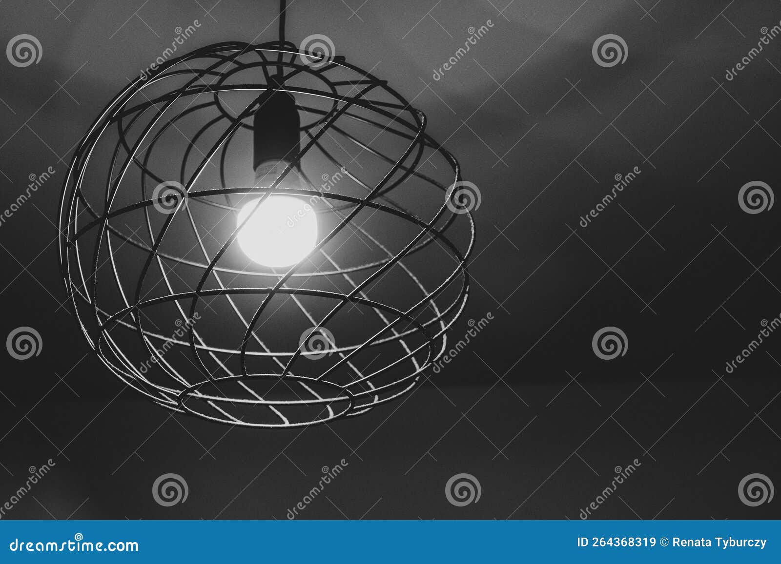 Side View of a Metal Ring Shape Lamp Shade with Glowing Light Bulb in ...
