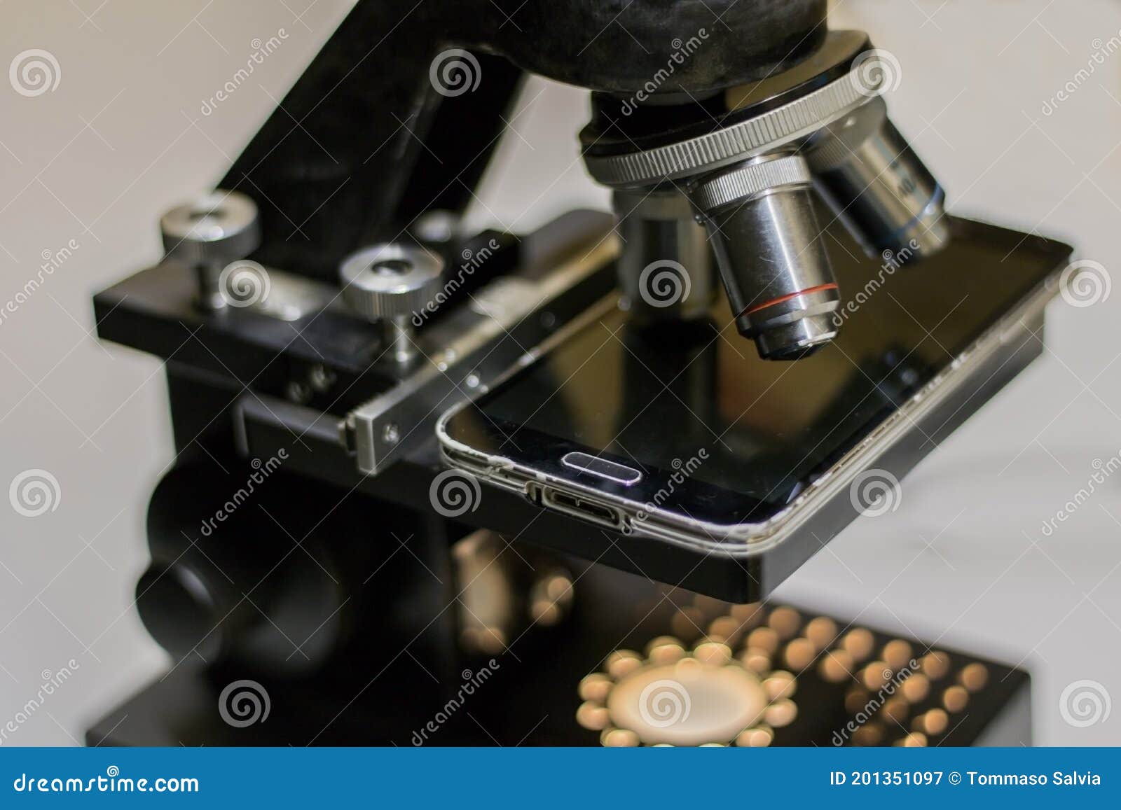 Side View of a Microscope that is Analyzing a Mobile Phone. Stock Image ...