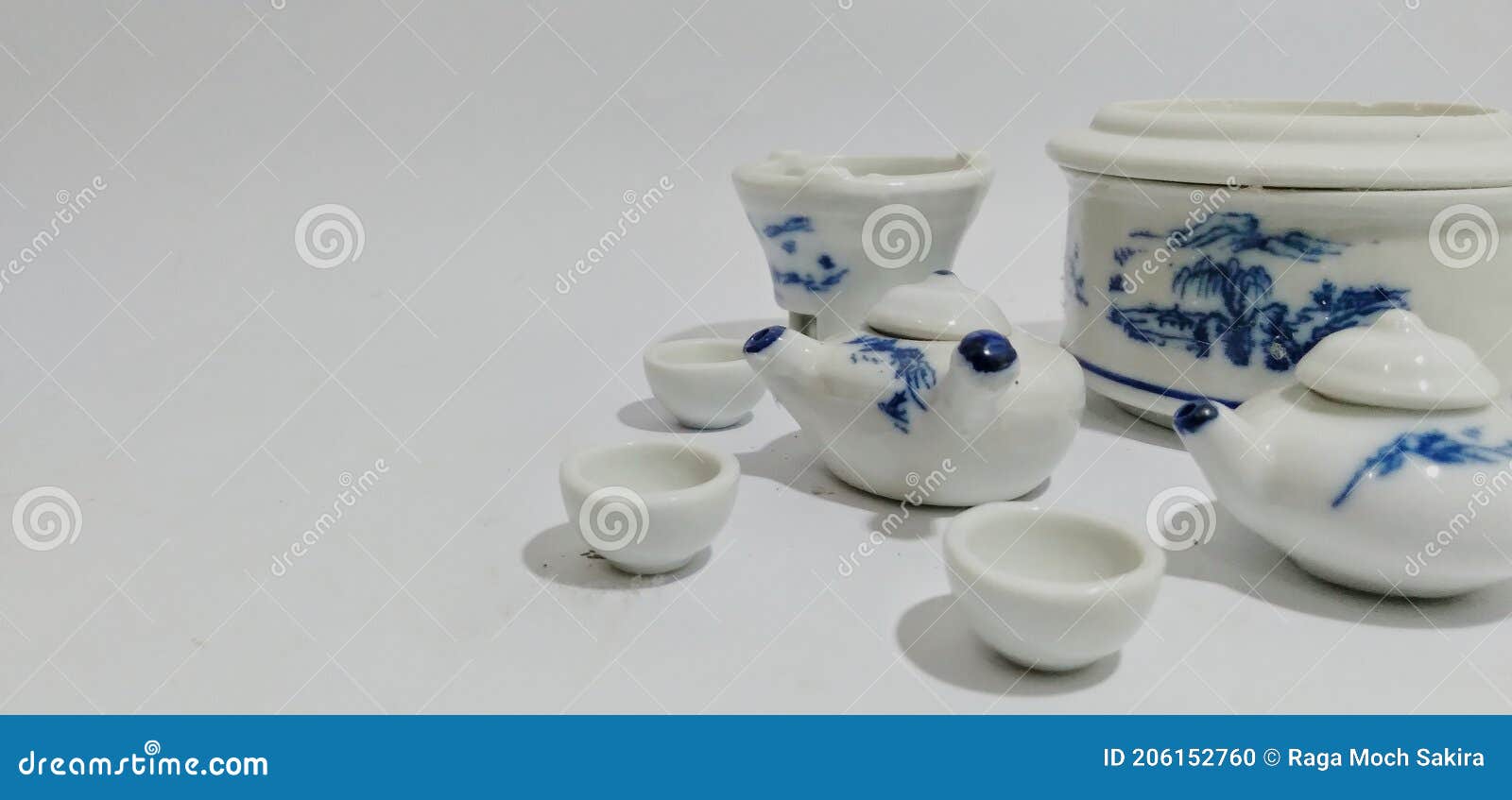 Side View of Miniature of Teapot and Cup Isolated on White Background ...