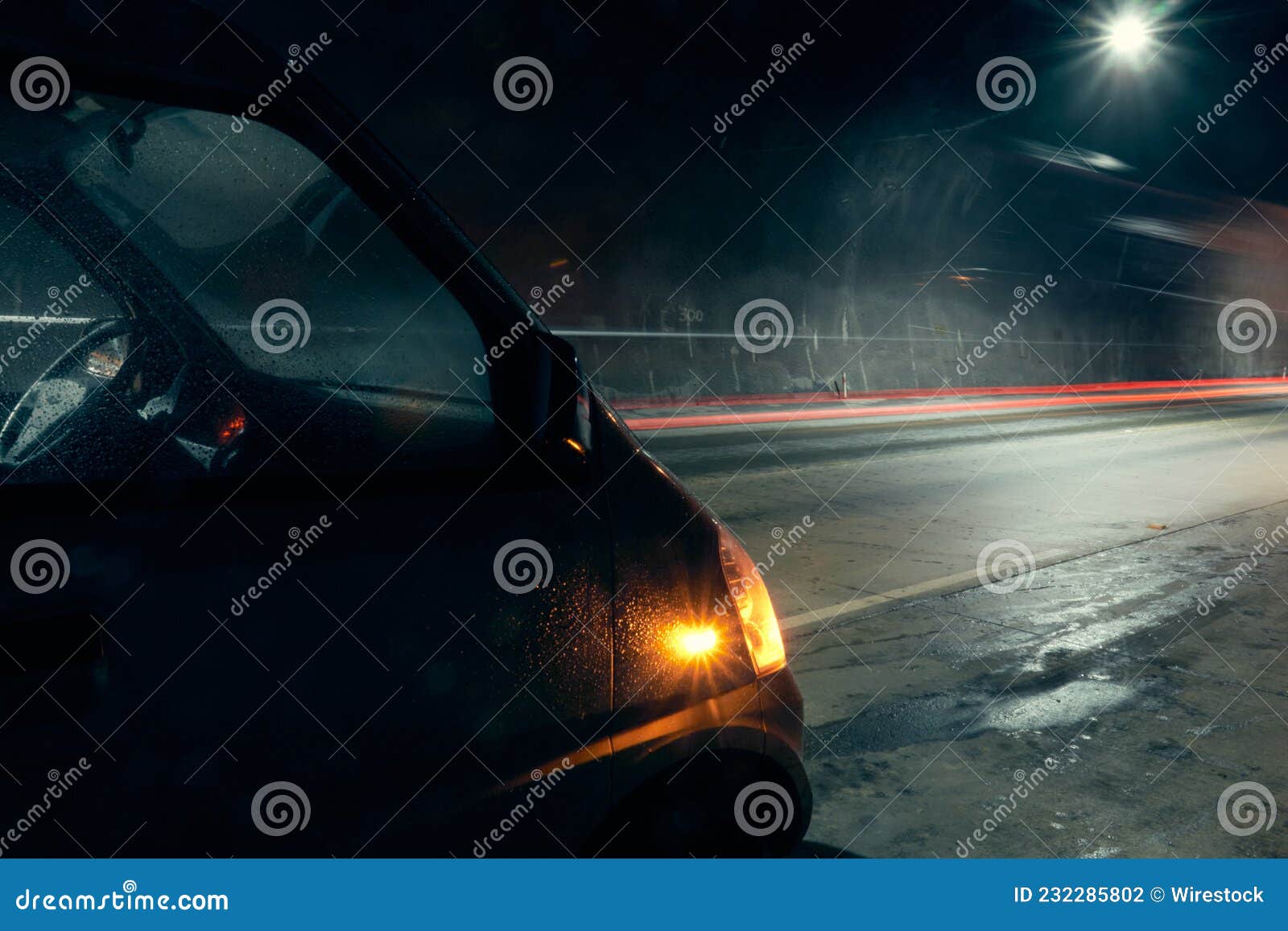 Side View of a Minivan in the Tunnel at Night with Headlights on Stock ...
