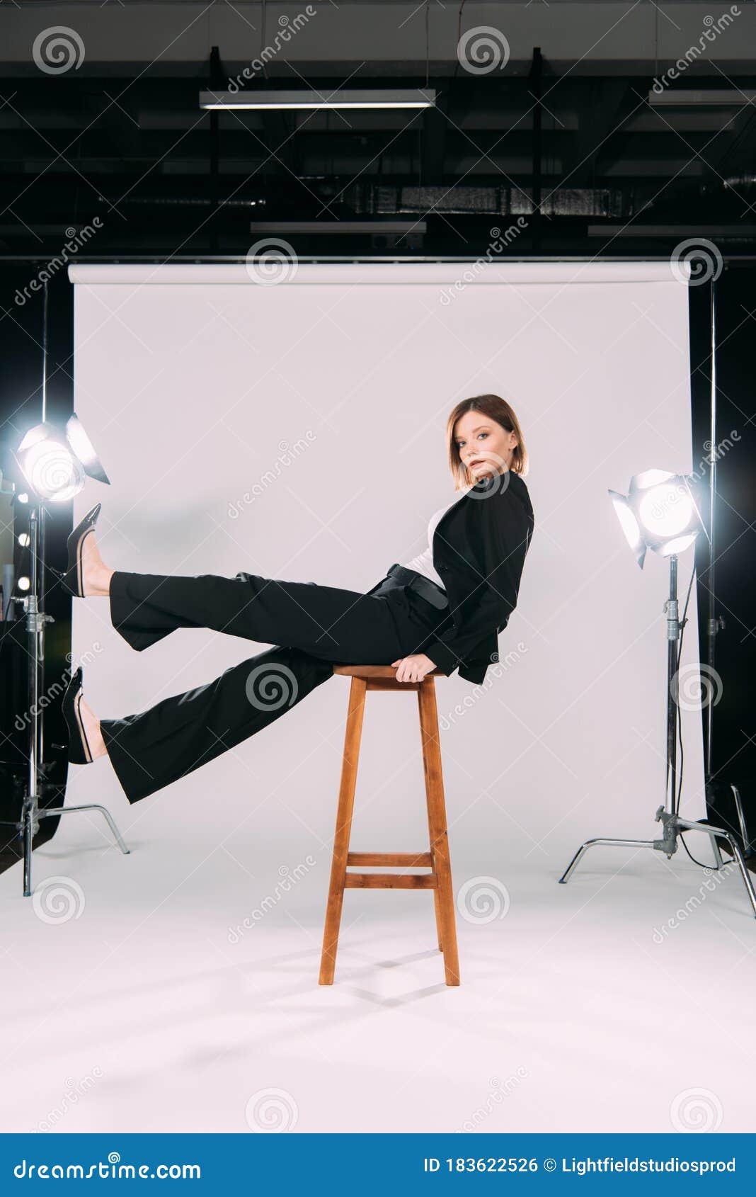 Side View of Stylish Model Looking Stock Photo - Image of tripods ...