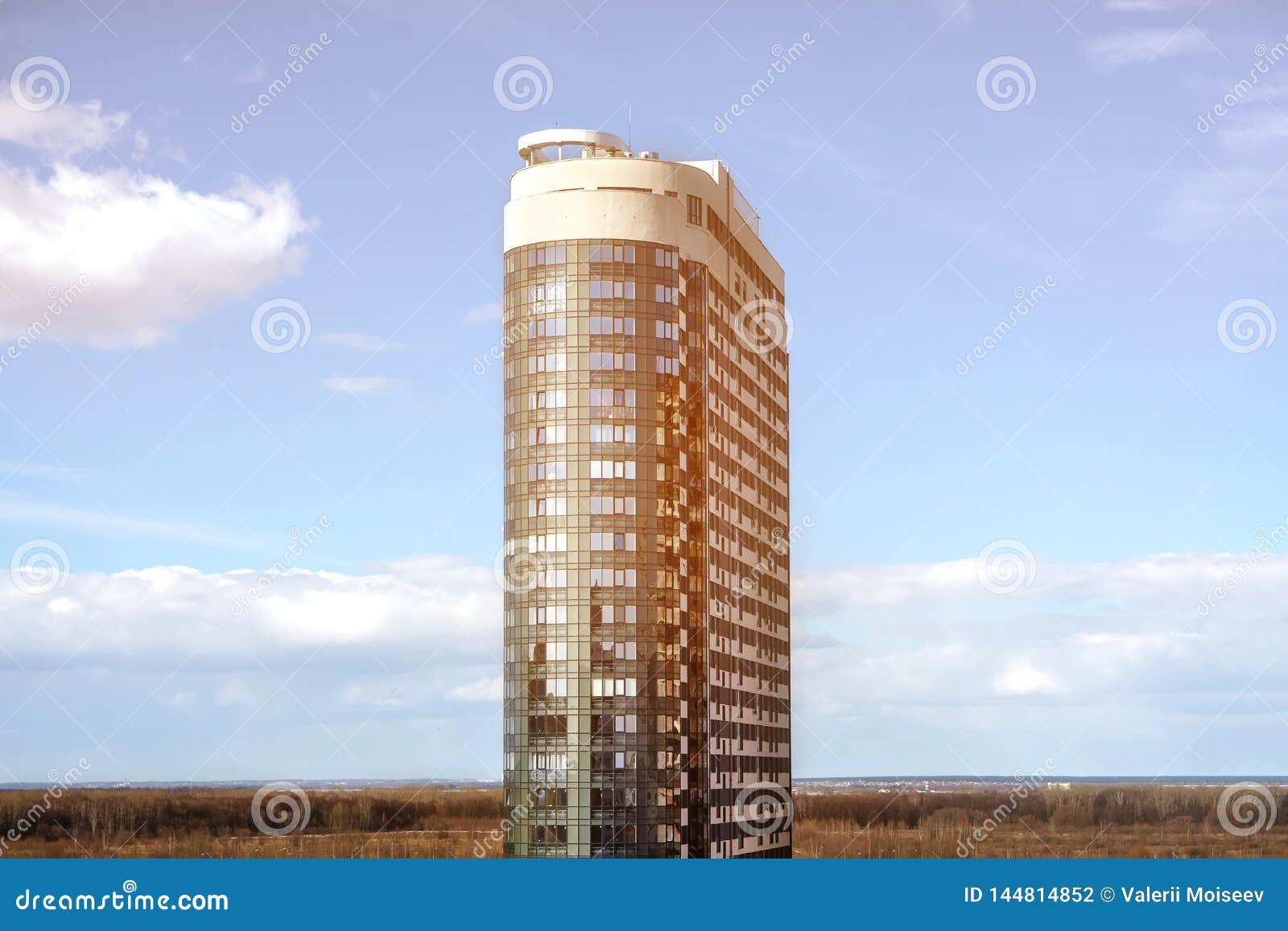 Side View Modern Skyscraper in the Rays of Sun and Clouds Stock Photo ...