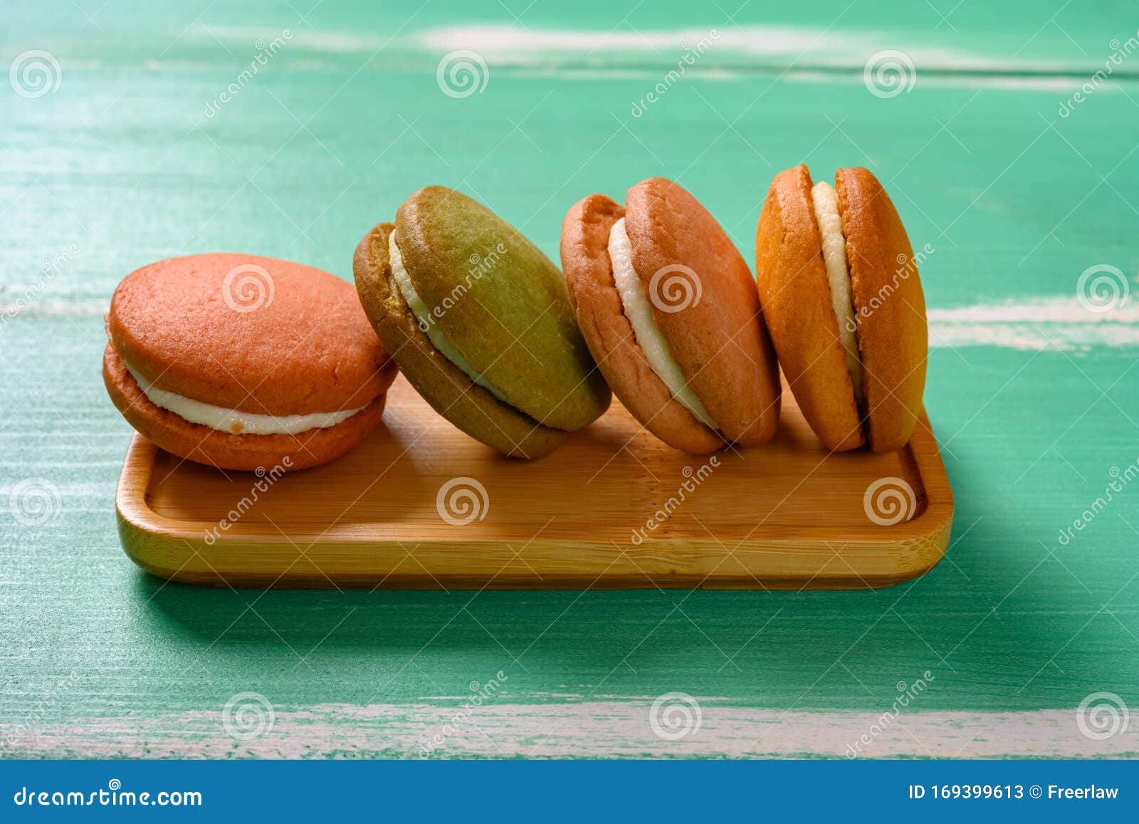 Side View Multi-color Macaroon on a Green Wood Table Stock Image ...