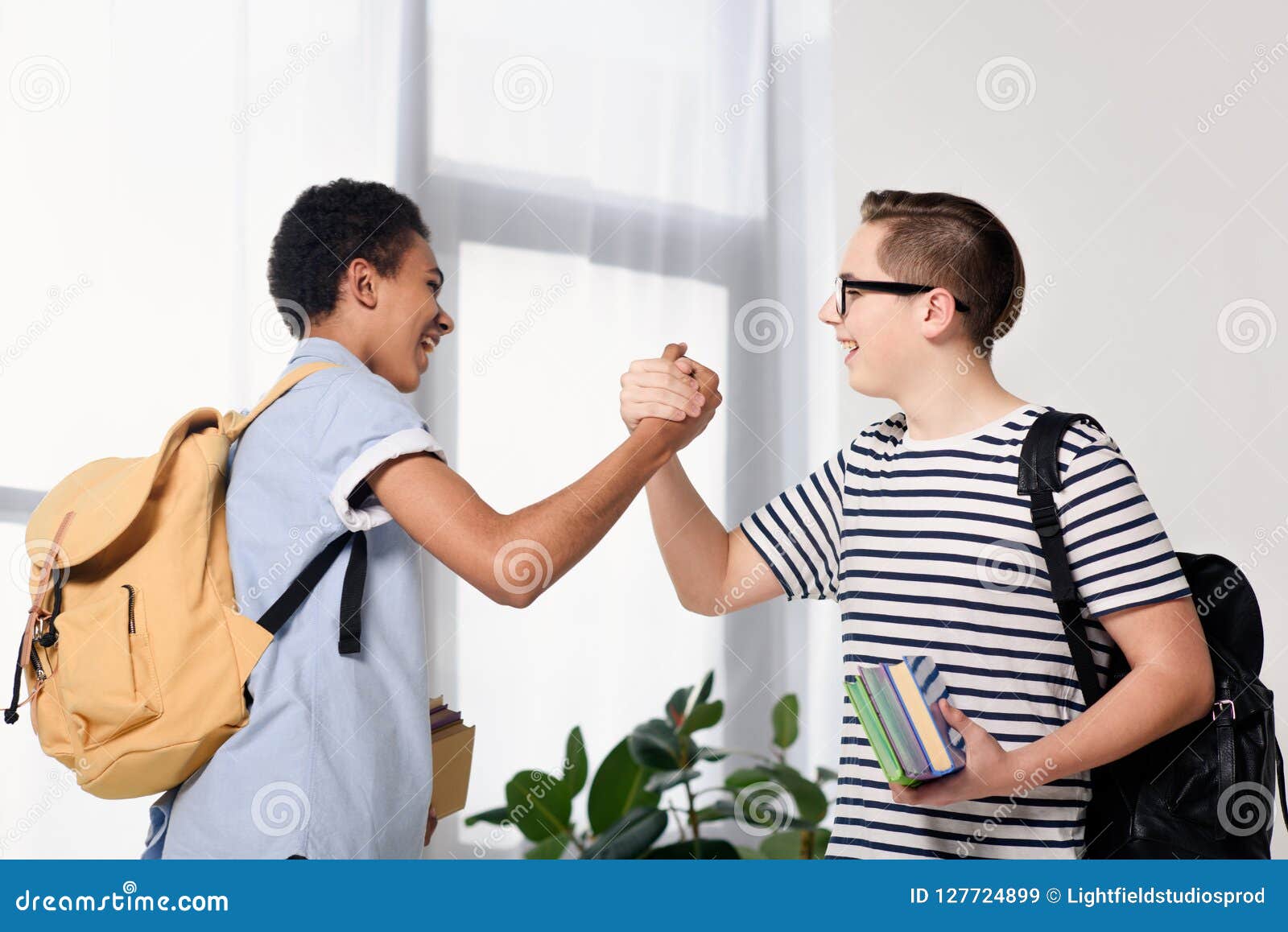 Side View of Multicultural Teen Boys Greeting at Home Stock Image ...