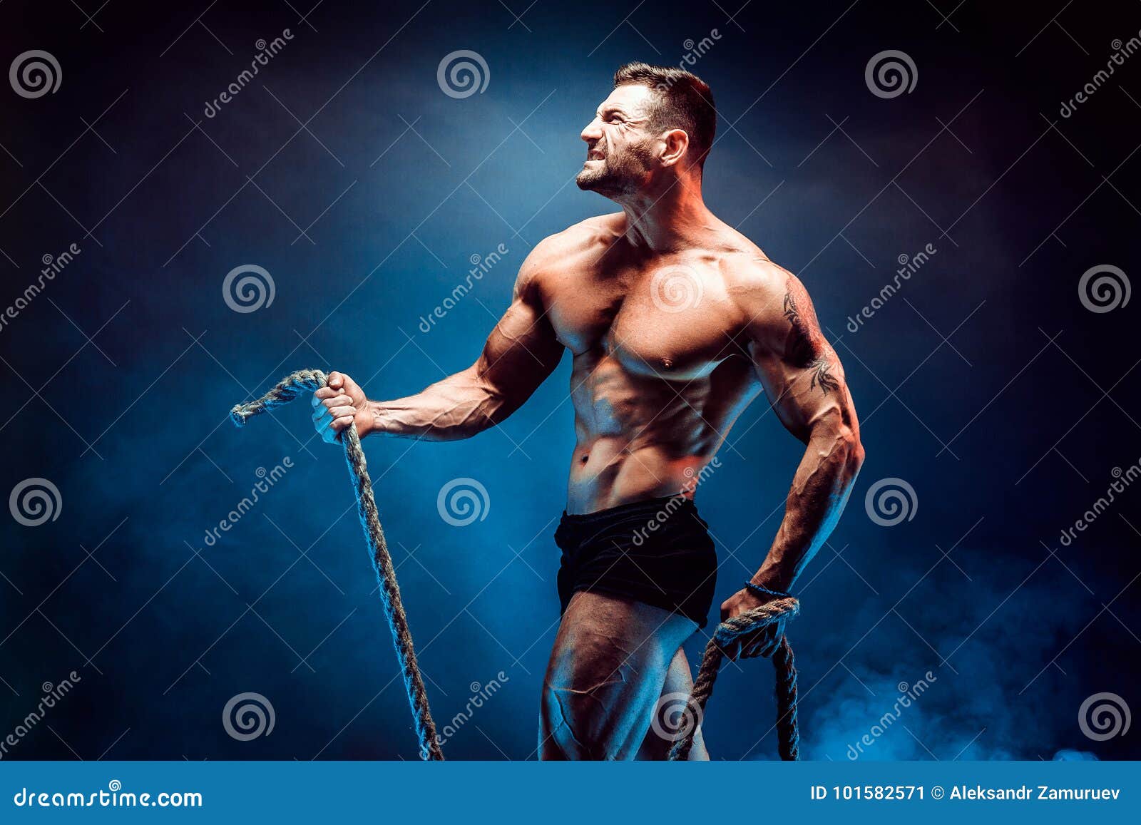 Man training with rope stock image. Image of bodybuilding - 101582571
