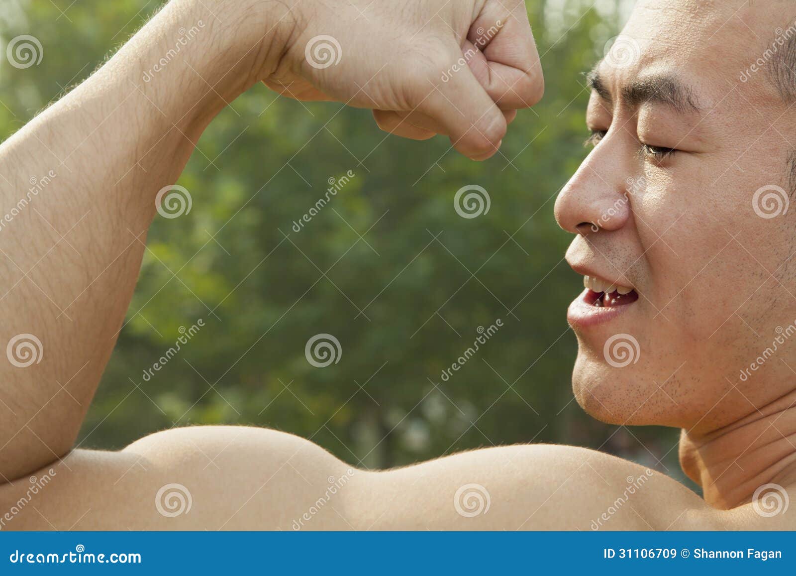 Side View Of Muscular Confident Man Showing Off And Flexing His Bicep ...