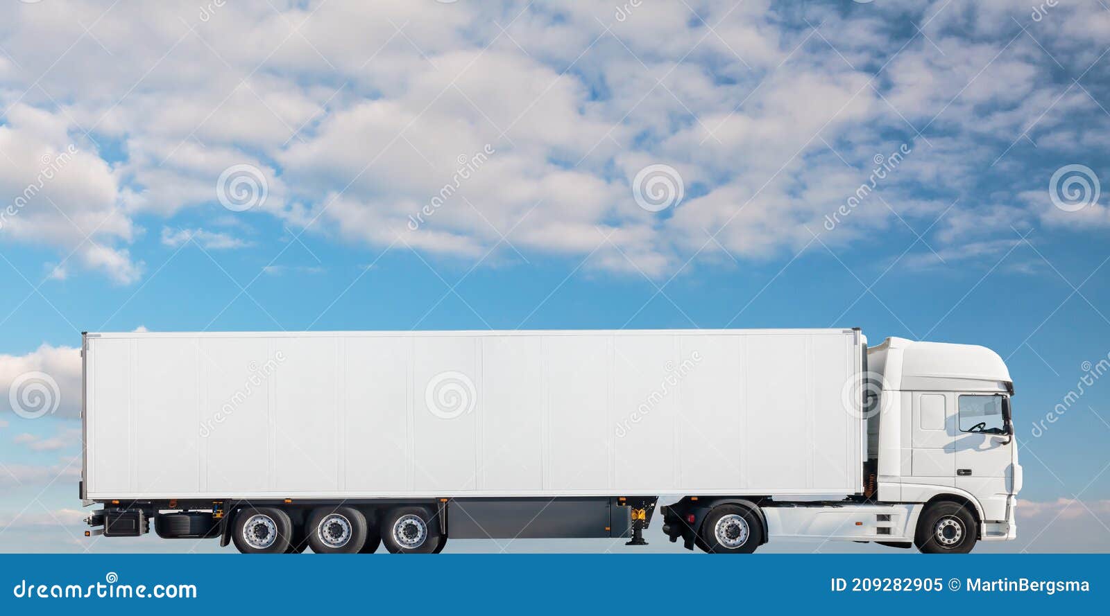 Side View of a New Large White Cargo Truck in Front of a Blue Sky Stock ...