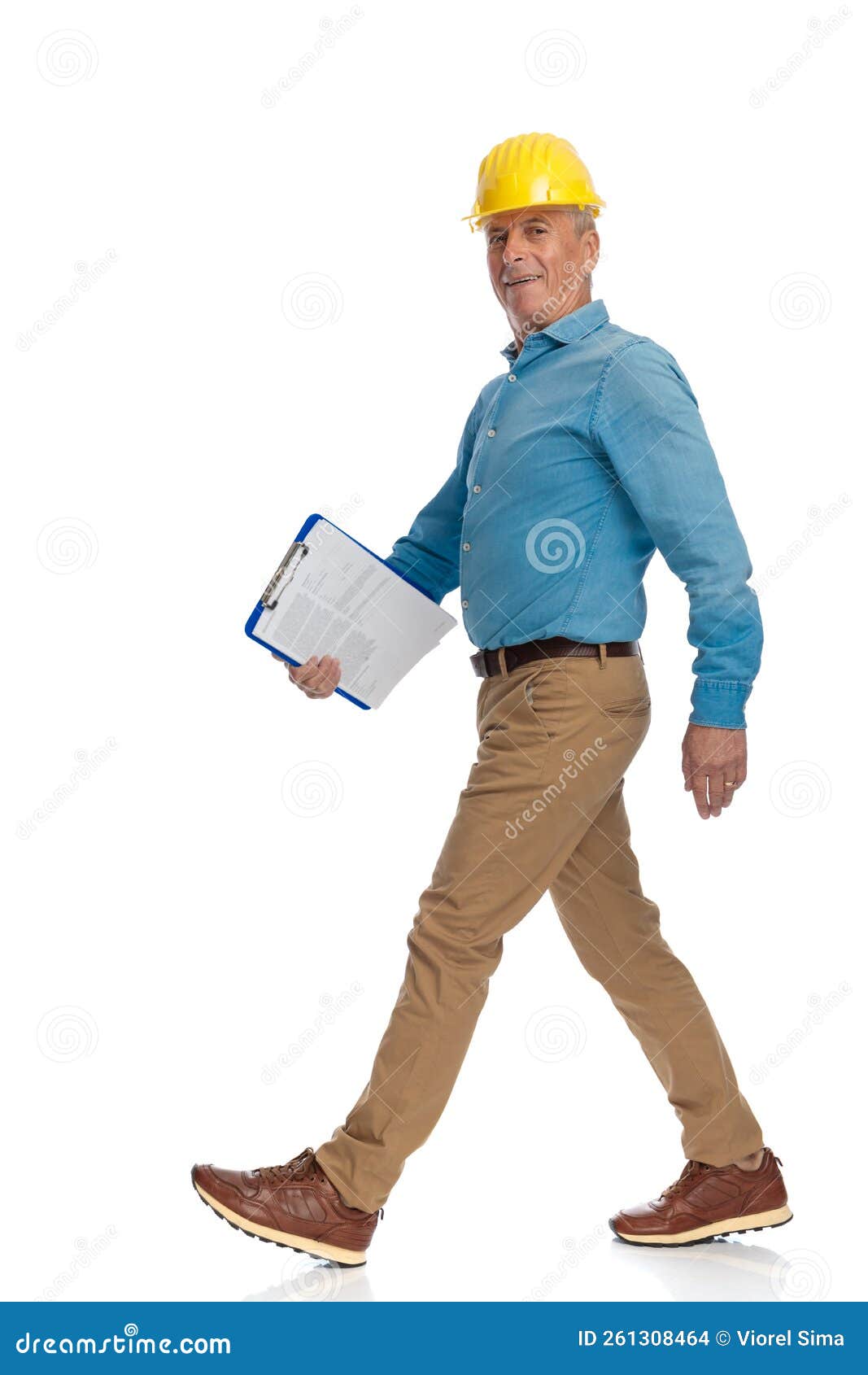 Side View of Old Engineer with Safety Helmet and Clipboard Smiling and ...