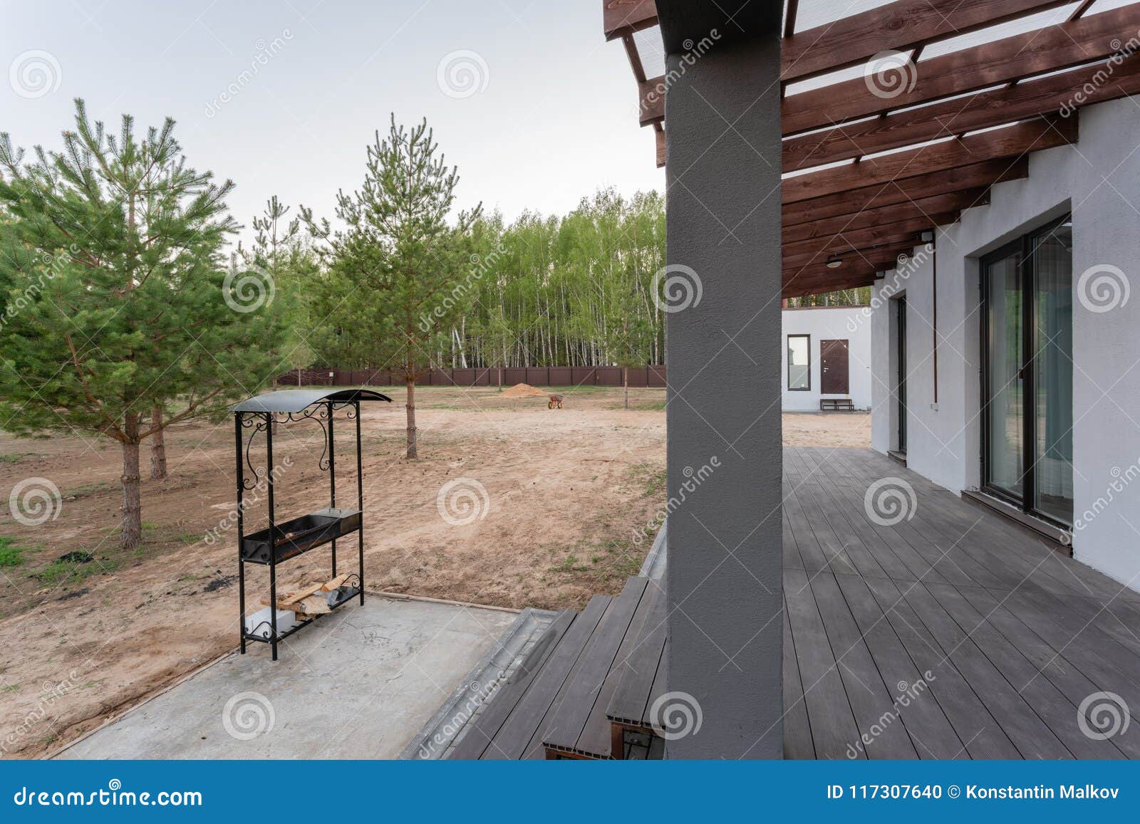 Side View of an Open Veranda in Front of a Modern Forest Cottage. Pine ...