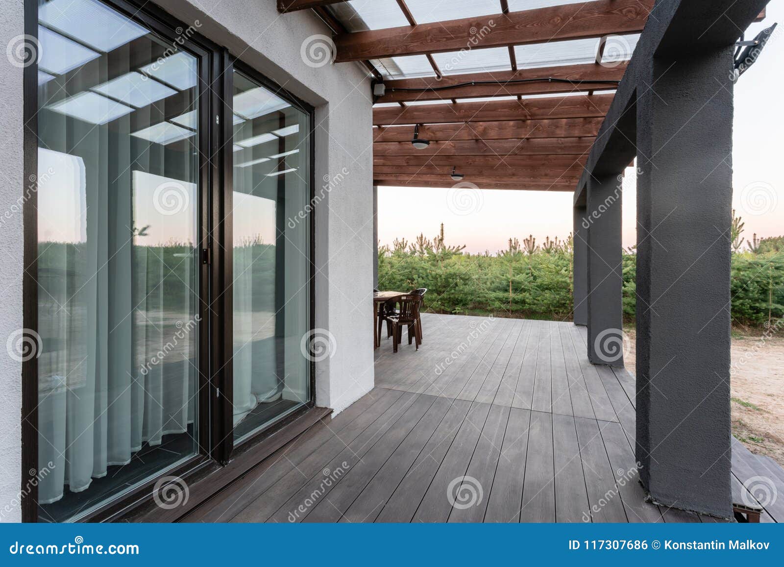 Side View of an Open Veranda in Front of a Modern Forest Cottage. Pine ...