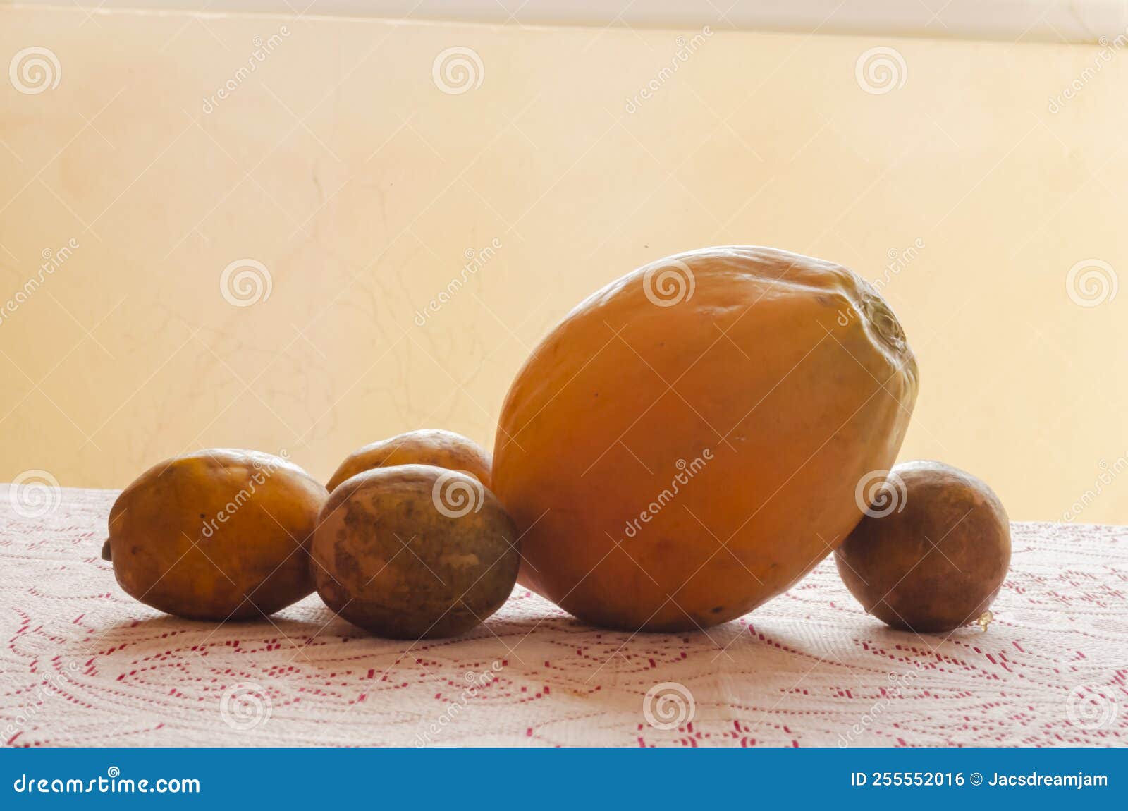 Side View of Papaya and June Plums Stock Photo - Image of four ...