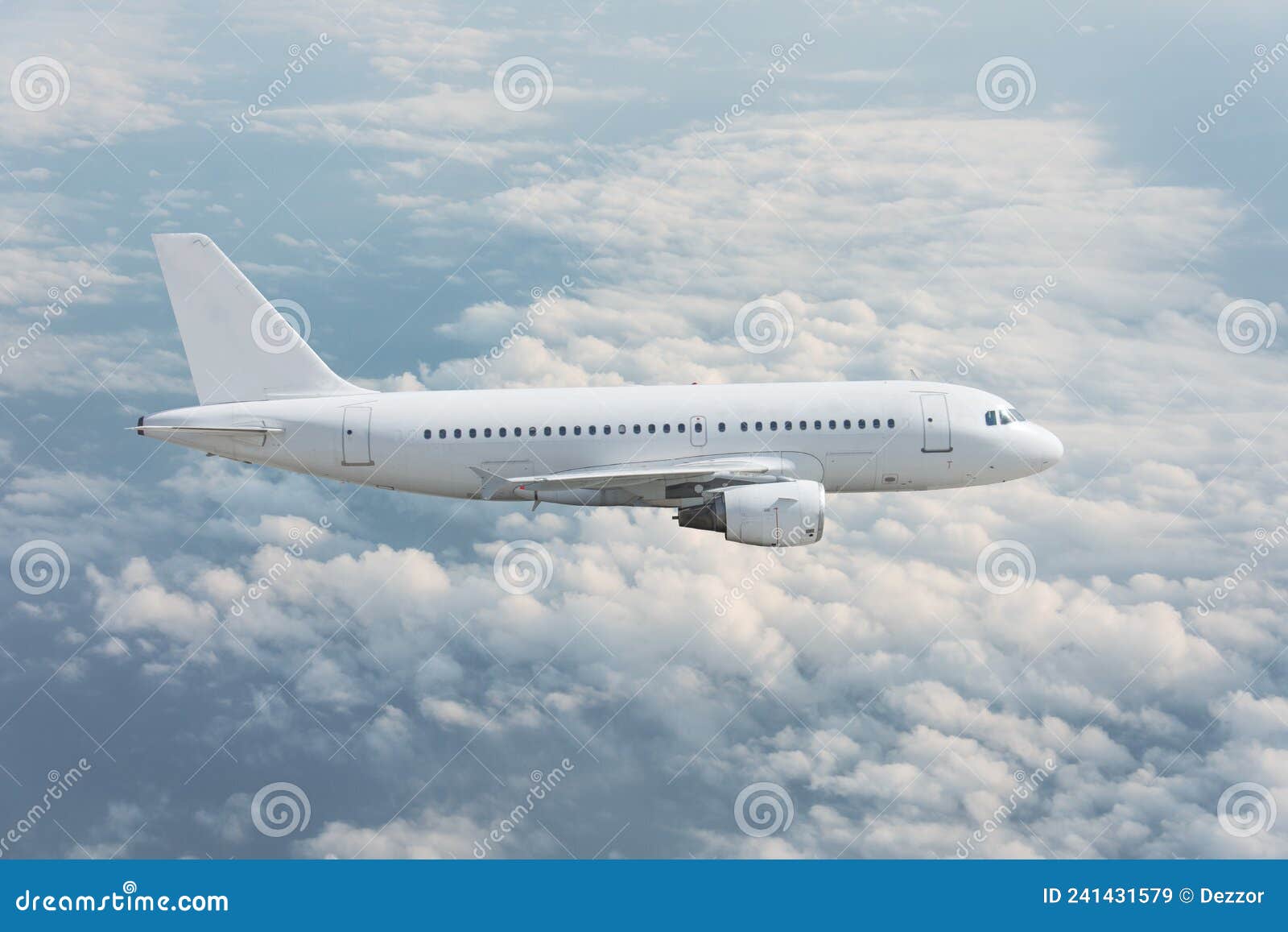 Side View of a Passenger Jet Liner Flying in the Clouds Stock Image ...