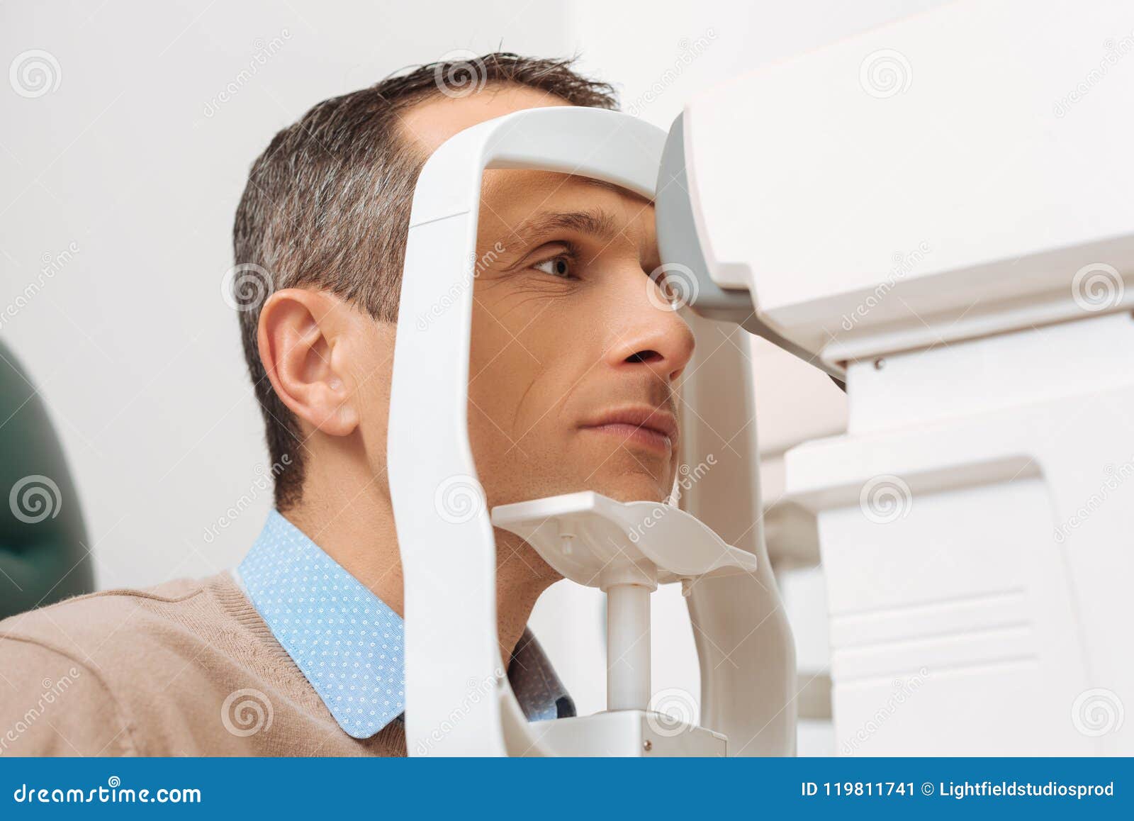 Side View of Patient Getting Eye Checked Stock Image - Image of clothes ...