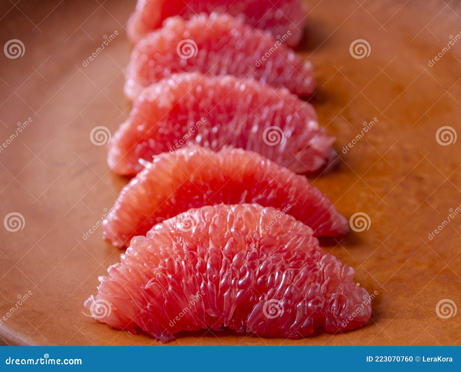 Side View of Peeled Grapefruit Slices on a Clay Plate Stock Photo ...