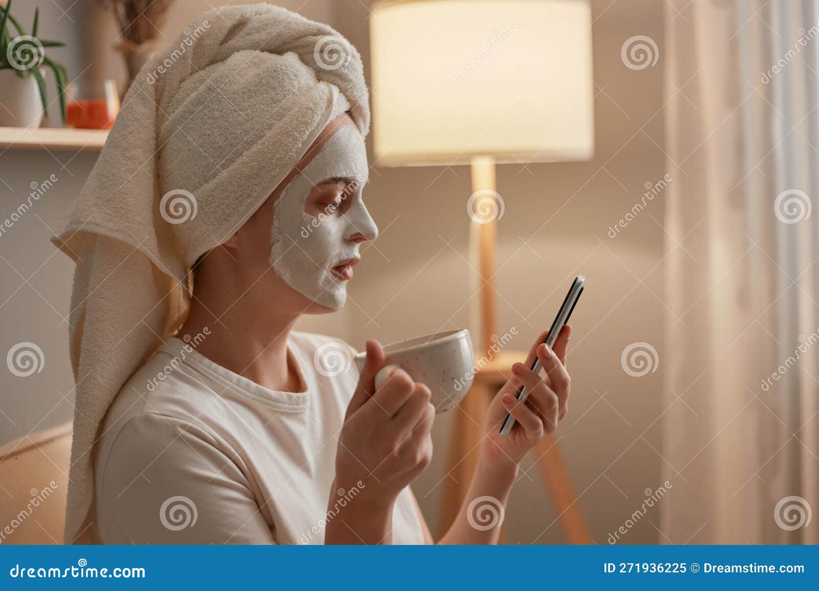 Side View Photo Of Beautiful Young Adult Female With Clay Mask On Her