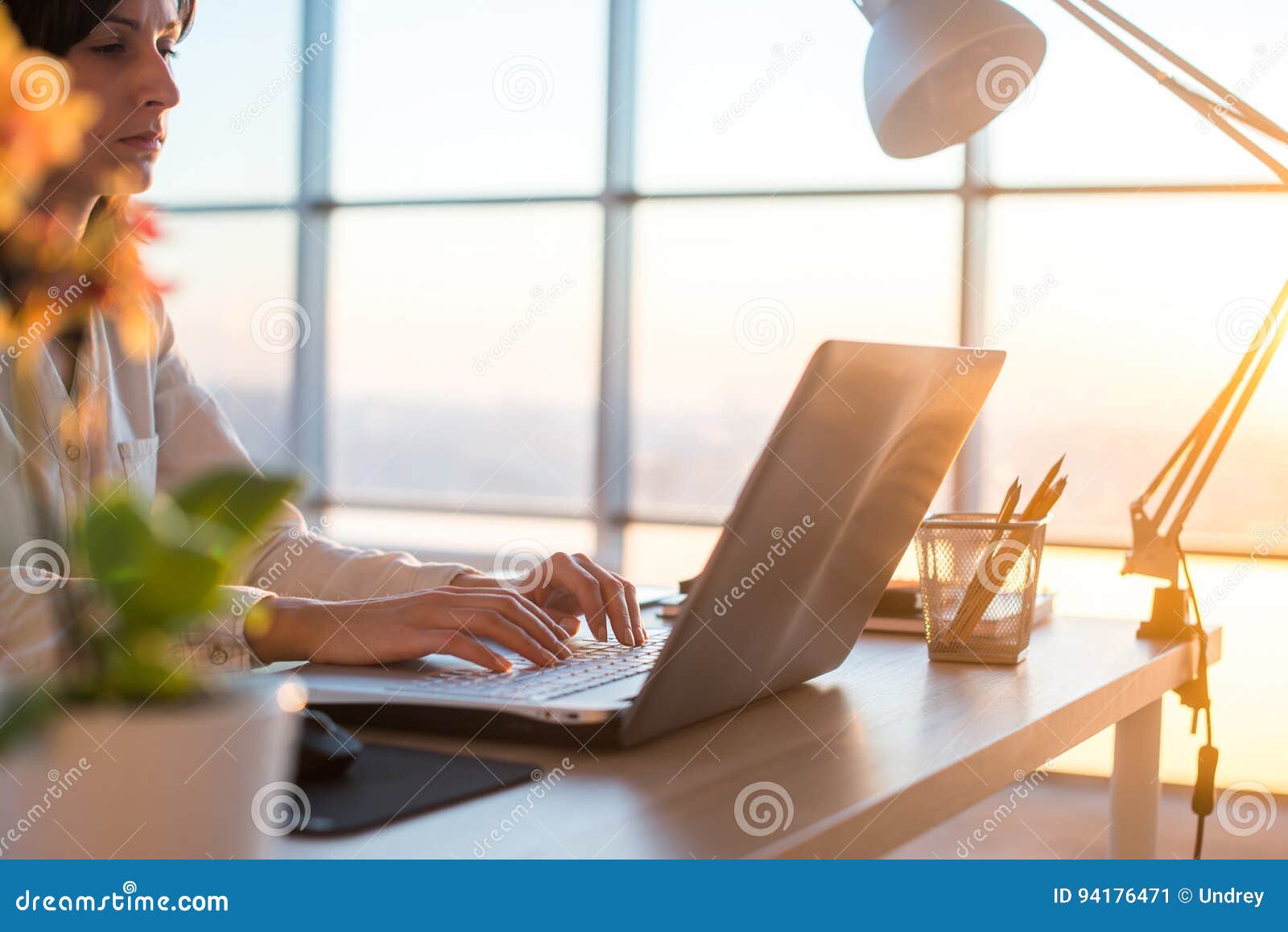 A Female Programmer Typing Source Codes And Using Mobile Phone In A ... A Female Programmer Typing Source Codes And Using Mobile Phone In A ...