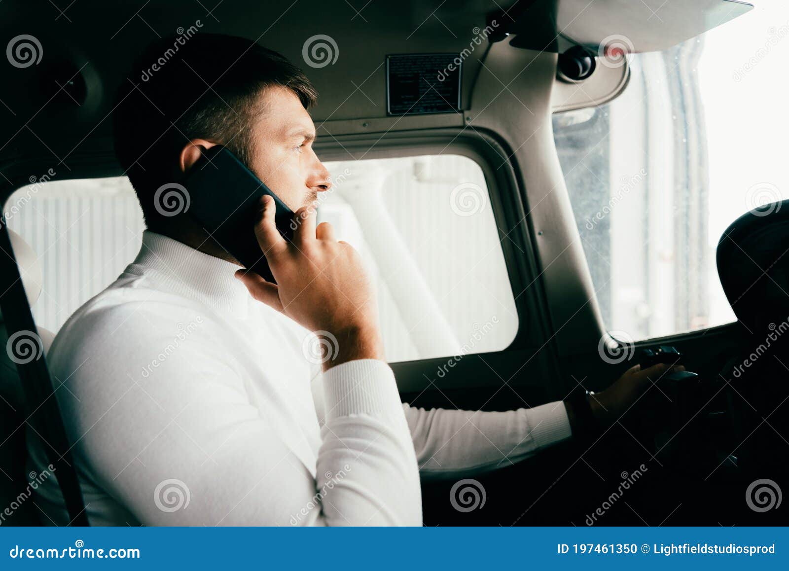 View of Pilot Talking on Smartphone in Plane Stock Photo - Image of ...