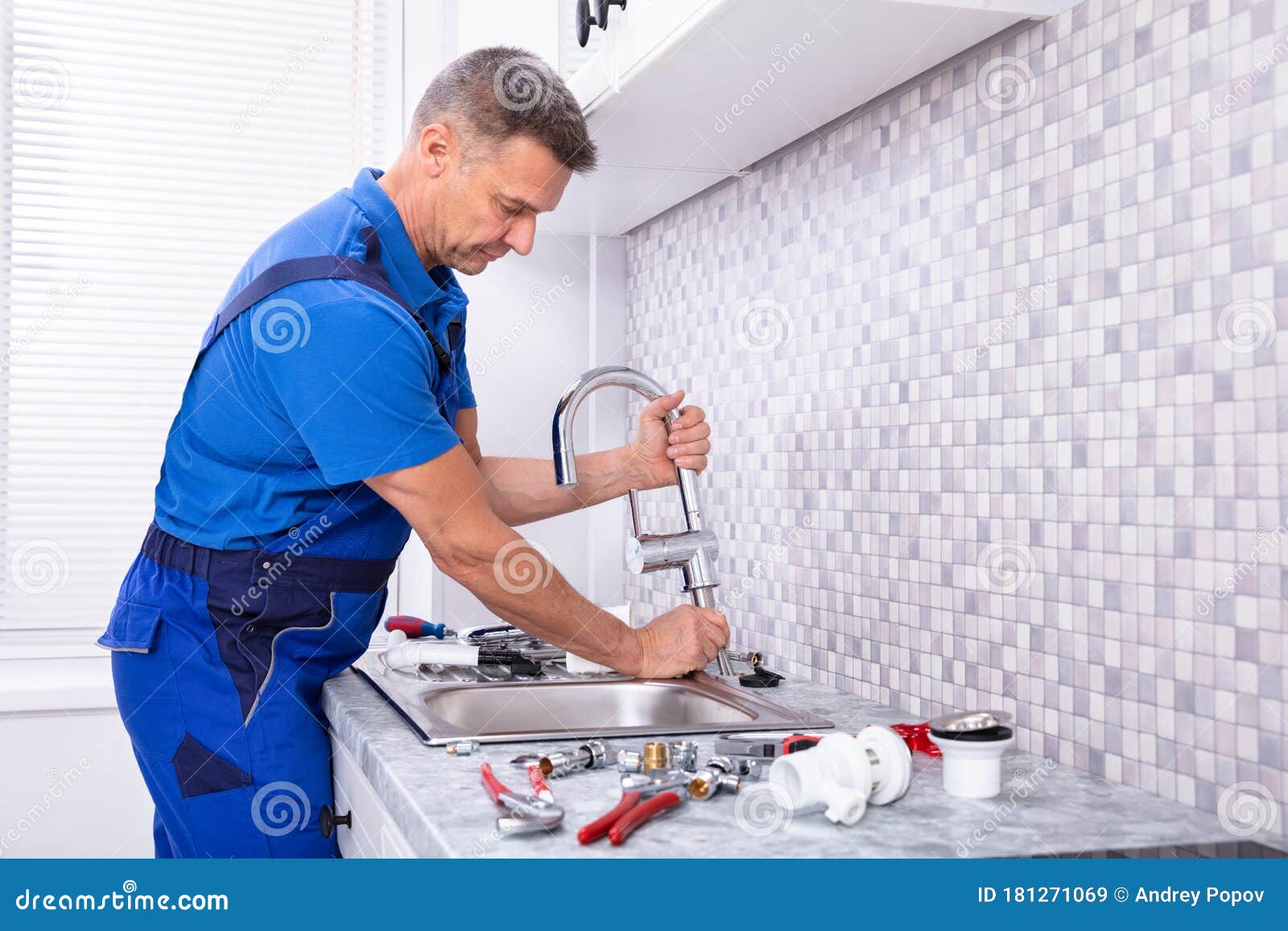 Worker Fixing Water Tap stock image. Image of indoors - 181271069