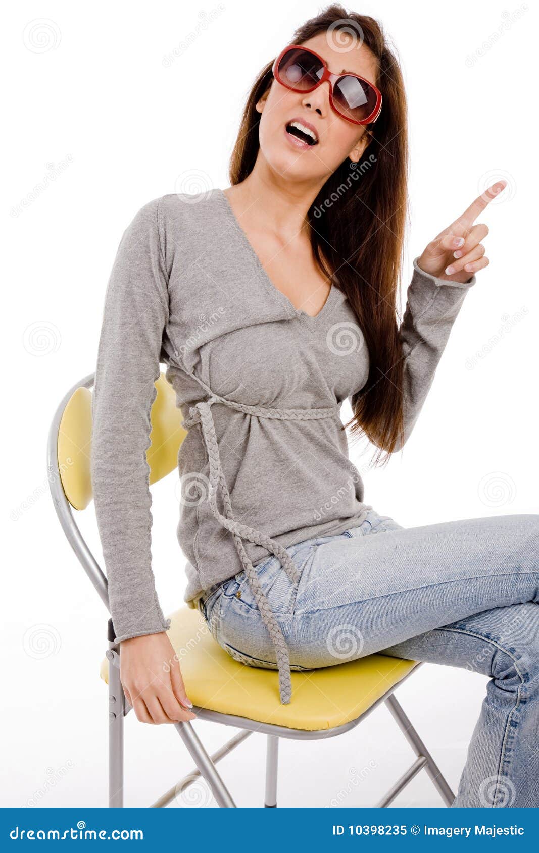 Side View of Pointing Female Sitting on Chair Stock Image - Image of ...