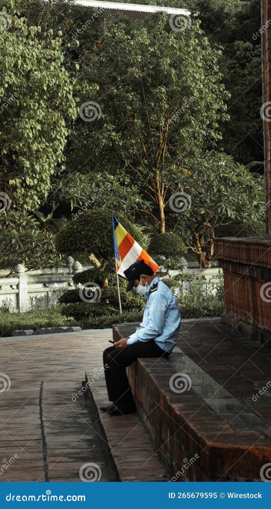 Side View of Policeman Sitting Near Building Stock Image - Image of ...