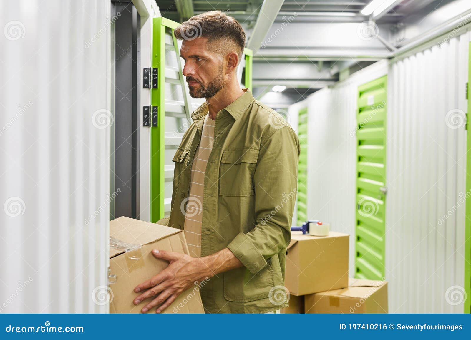 Man Loading Boxes in Storage Unit Stock Photo - Image of people ...