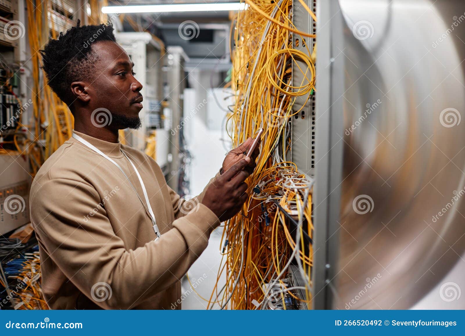 System Administrator Setting Up Server and Using Smartphone Stock Photo ... System Administrator Setting Up Server and Using Smartphone Stock Photo ...