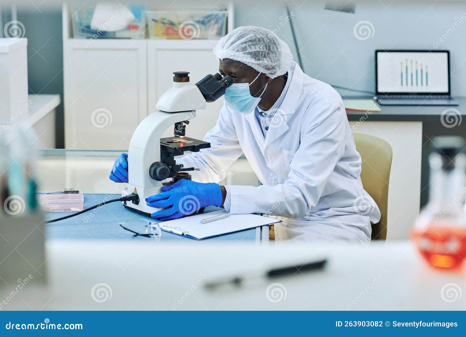 Black Scientist Using Microscope in Laboratory Stock Photo - Image of ...