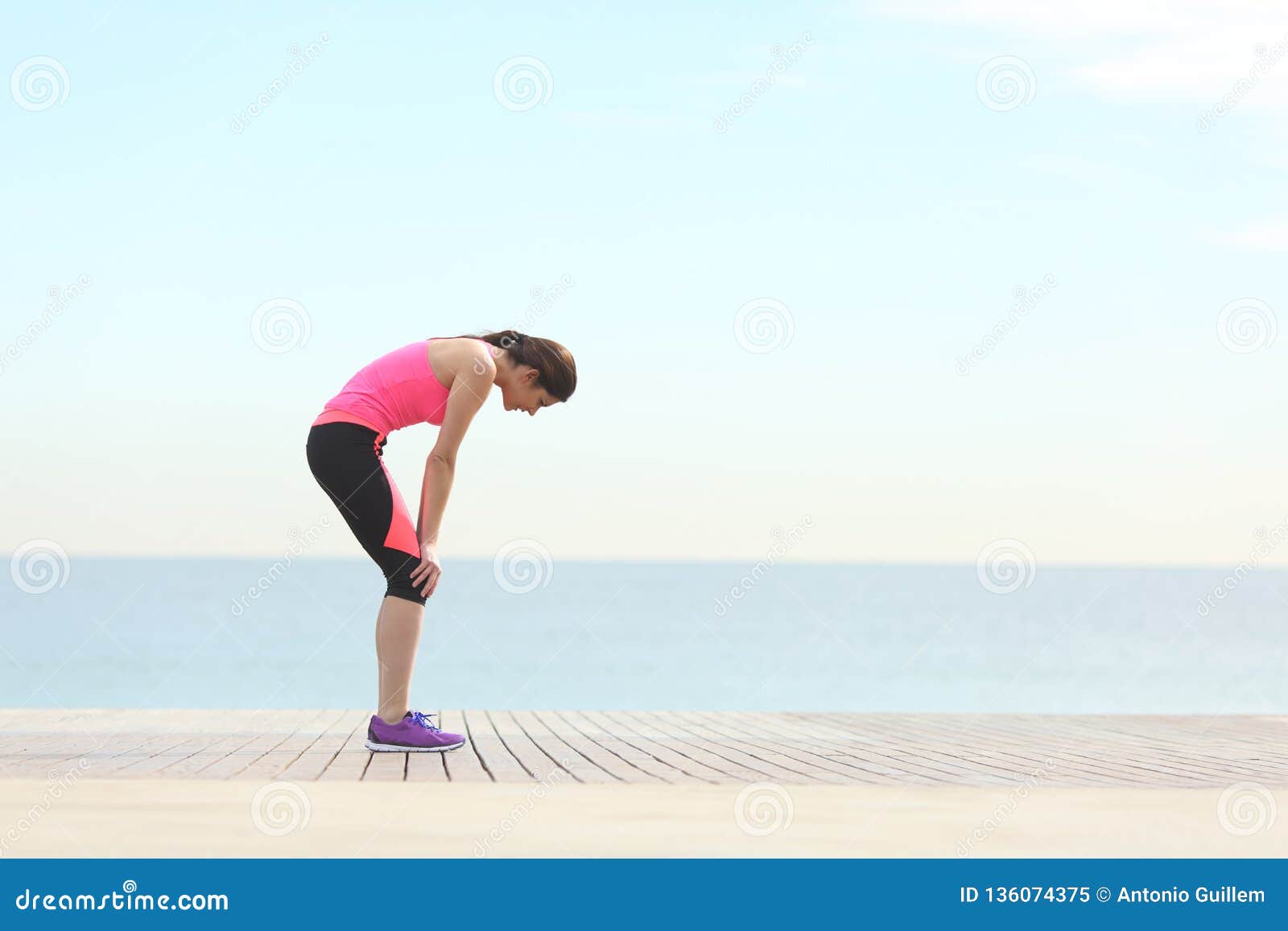 Exhausted Runner Resting on the Beach after Exercise Stock Image ...