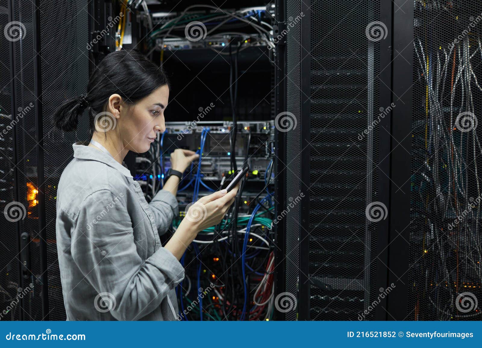 Woman Working with Server stock photo. Image of fixing - 216521852