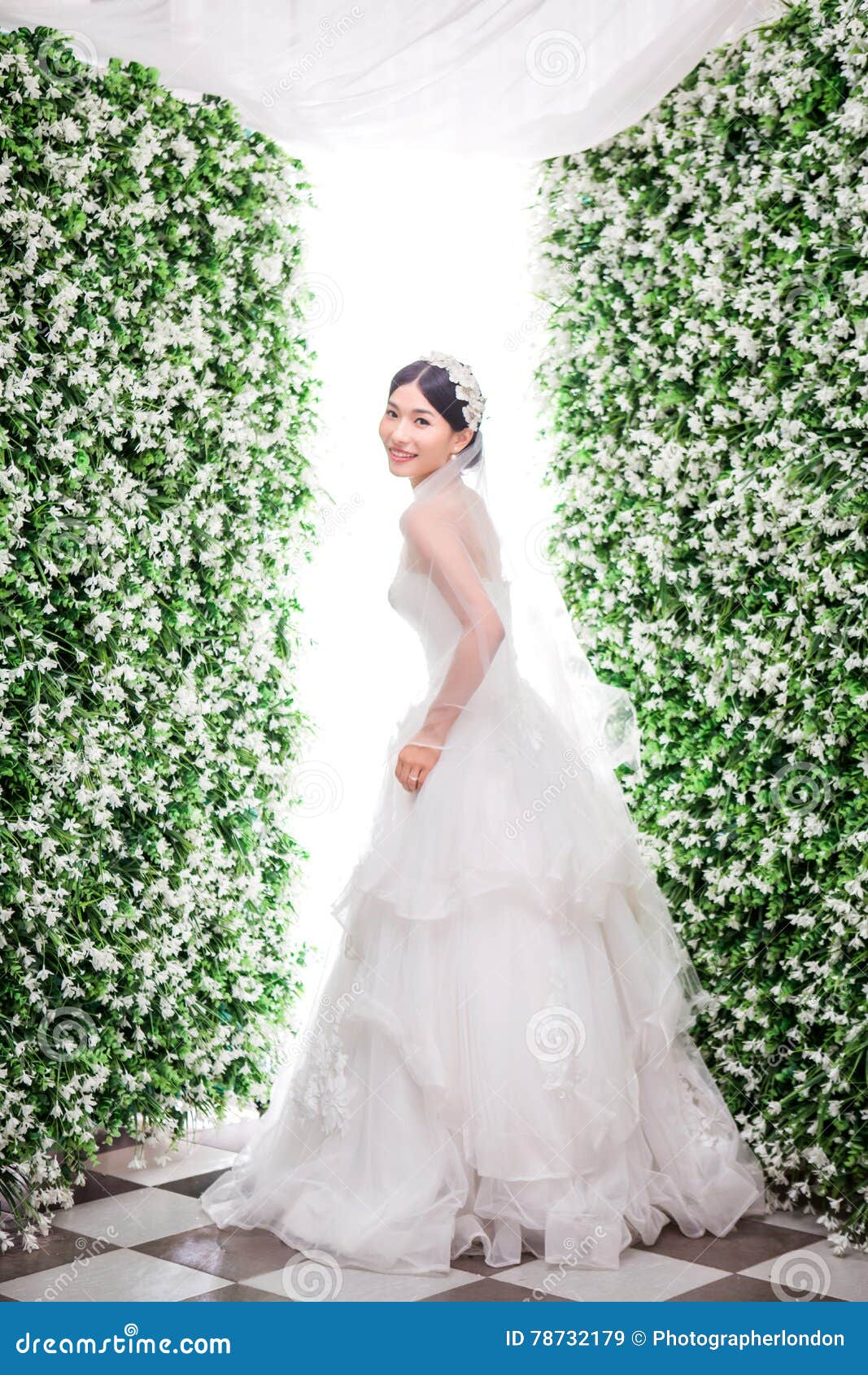 Side View Portrait of Smiling Bride Standing Amidst Flower Decorations ...