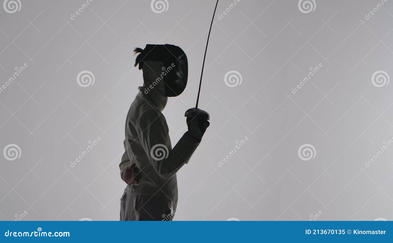 Side View Portrait of Young Guy with Rapier in His Hands on Gray Studio ...