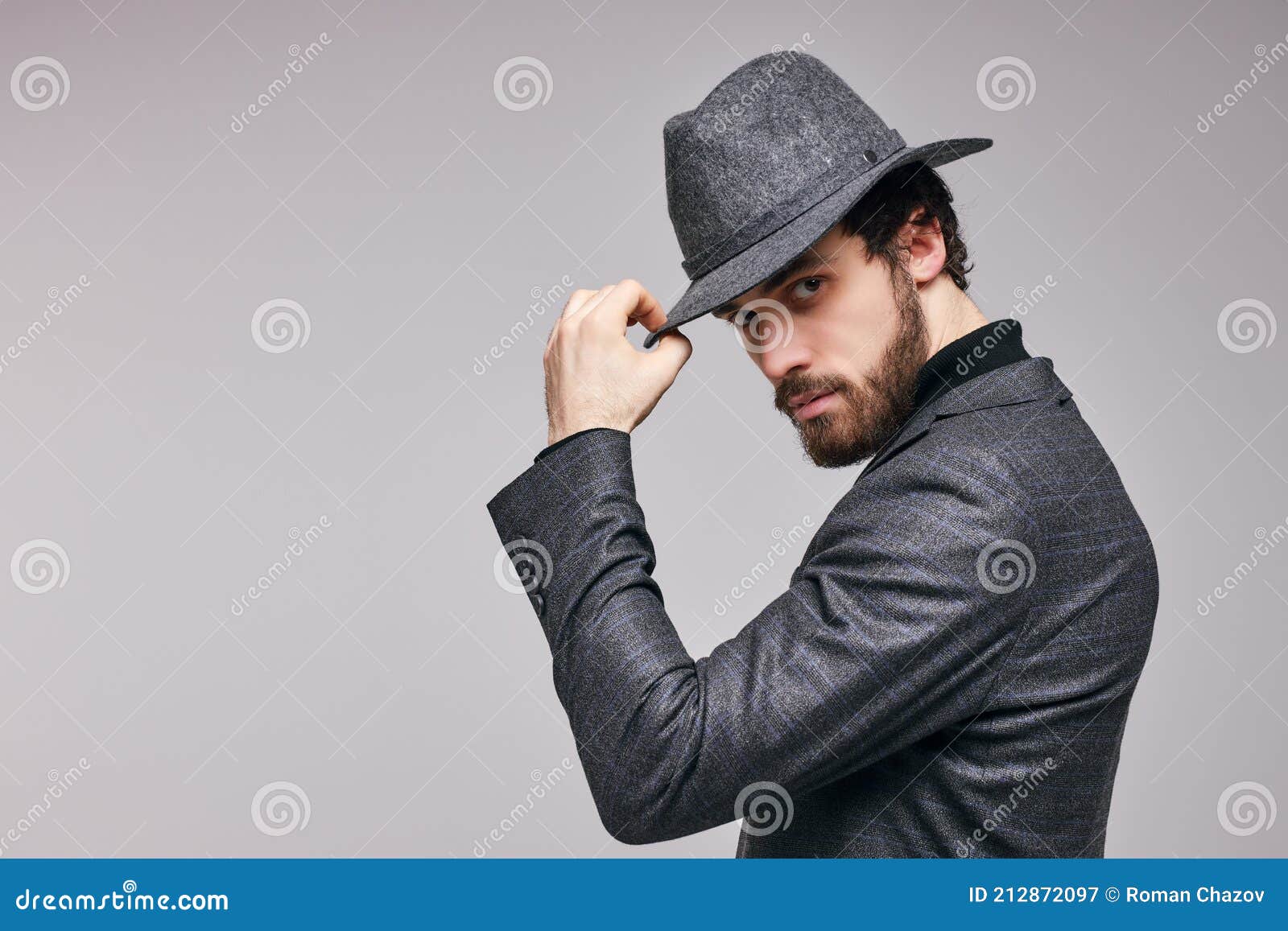 Side View Portrait of Young Male in Suit Posing Looking at Camera ...
