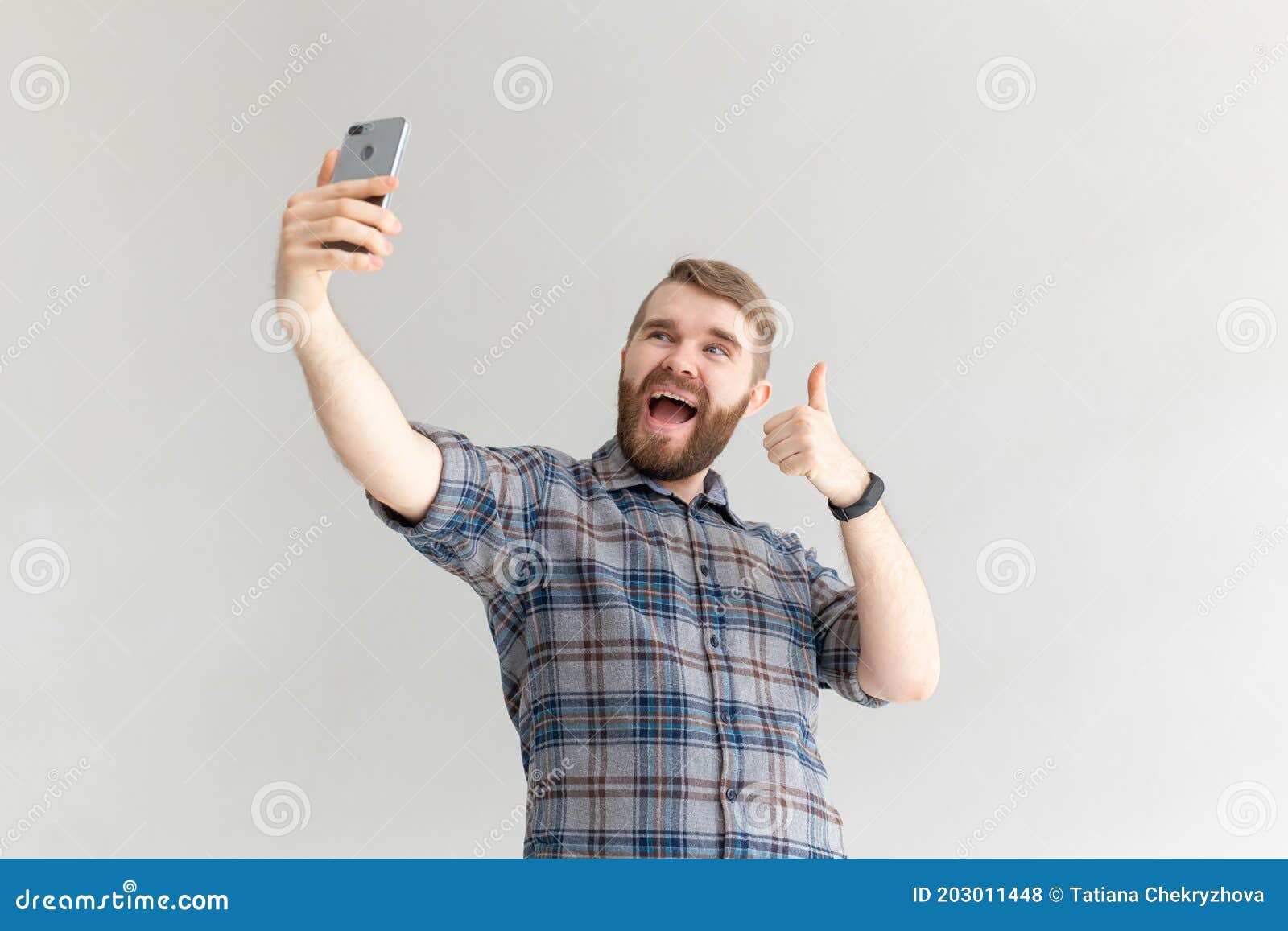 Side View of a Positive Funny Handsome Hipster Guy and Taking a Selfie ...