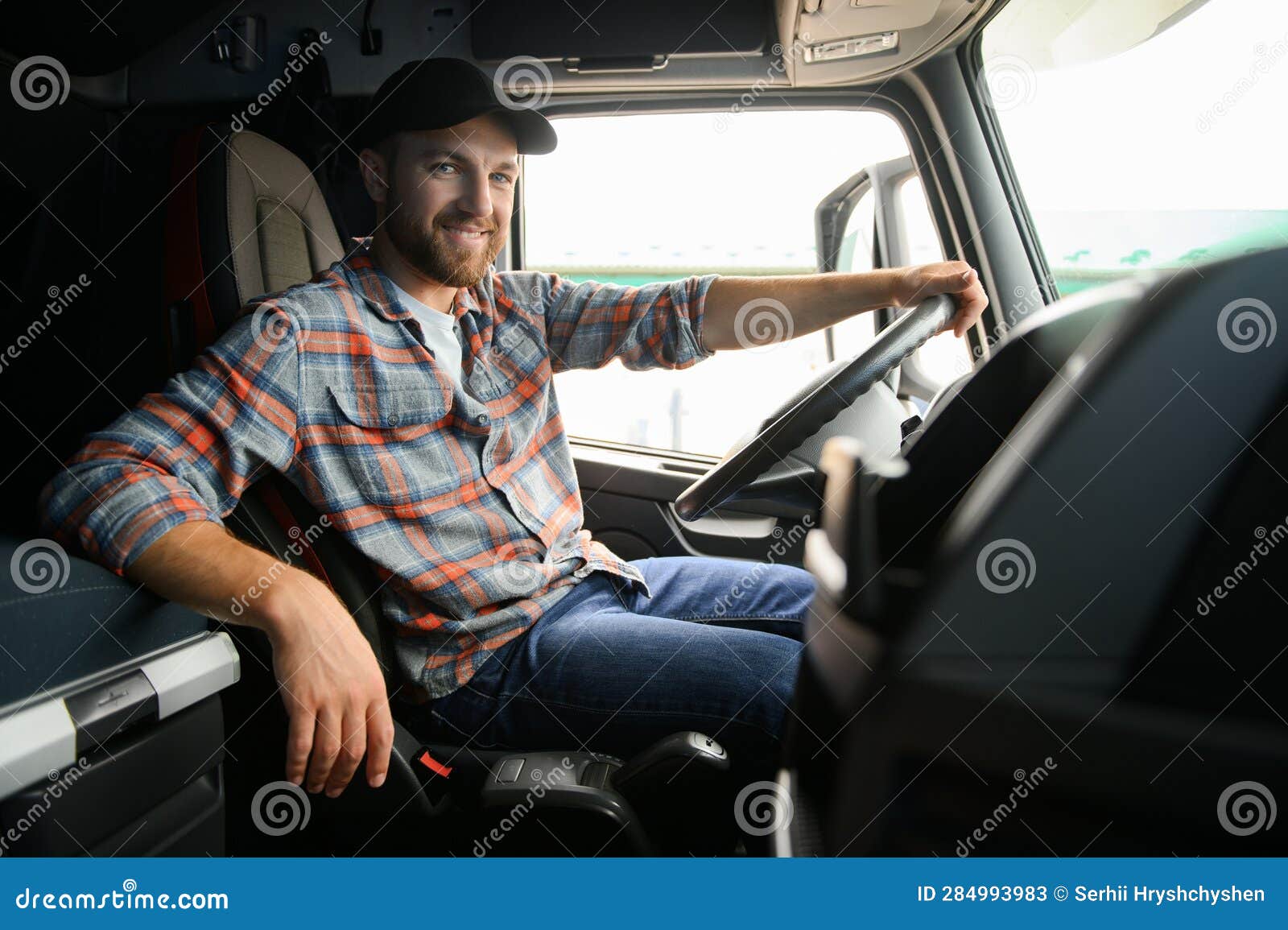 Side View of Professional Driver Behind the Wheel in Truck S Cabin ...