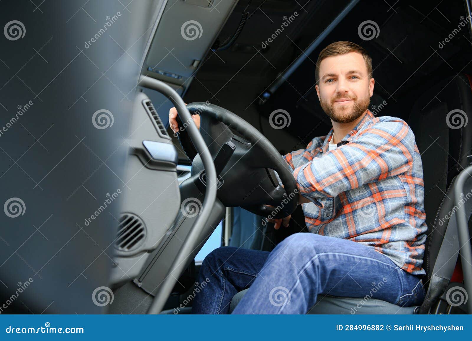 Side View of Professional Driver Behind the Wheel in Truck S Cabin ...