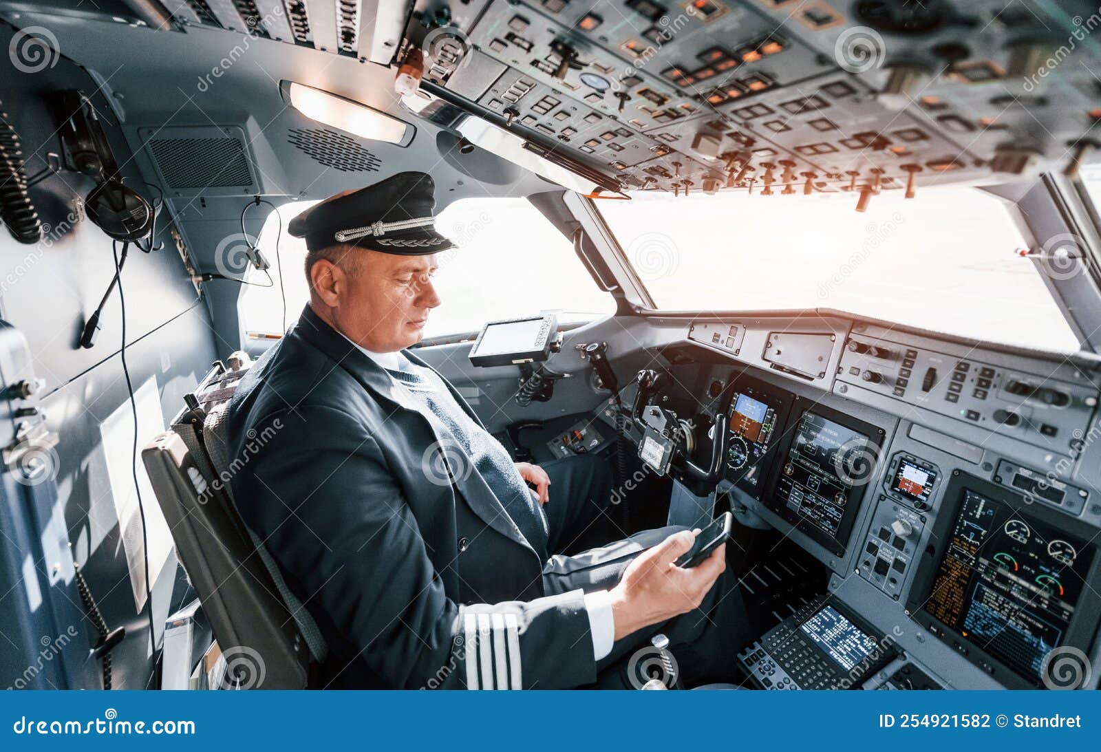 Side View. a Professional Pilot is in the Cockpit Stock Photo - Image ...