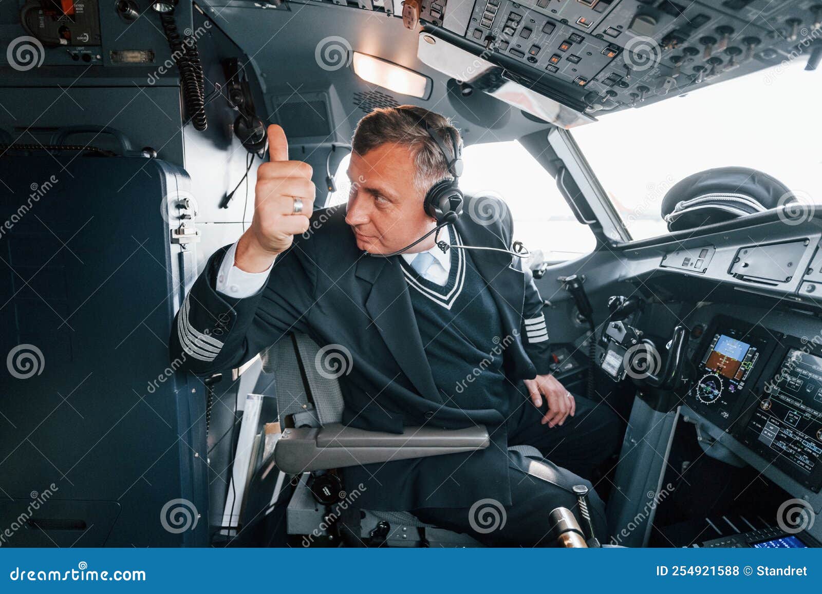 Side View. a Professional Pilot is in the Cockpit Stock Photo - Image ...